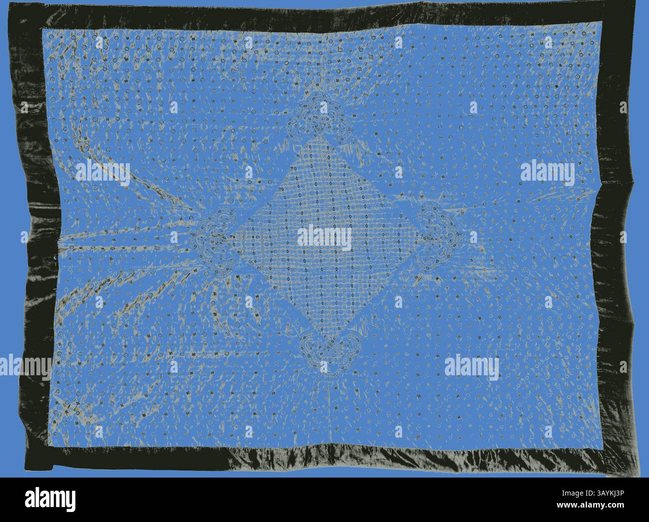 An intricately designed textile featuring a diamond pattern at its ...