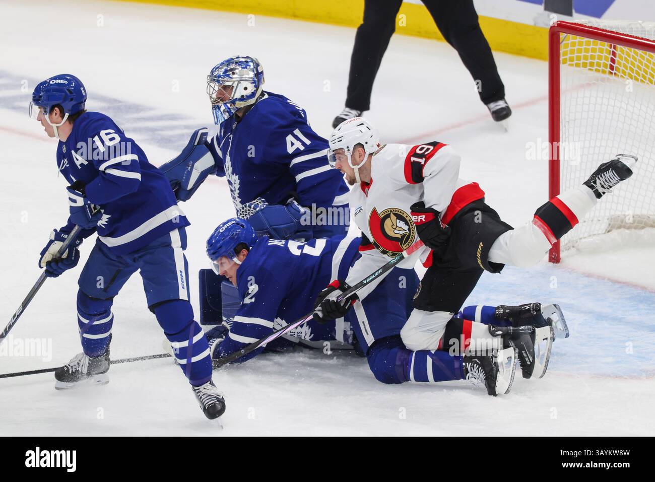 Ottawa Senators' Drake Batherson (19) and Toronto Maple Leafs' Jake ...