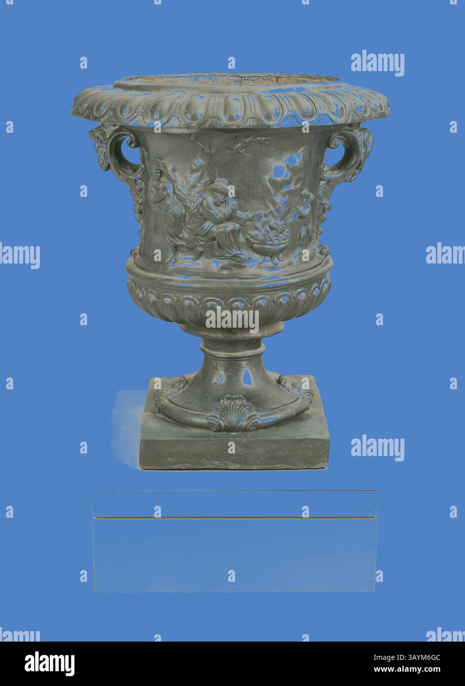 An ornate decorative urn featuring intricate relief sculptures ...