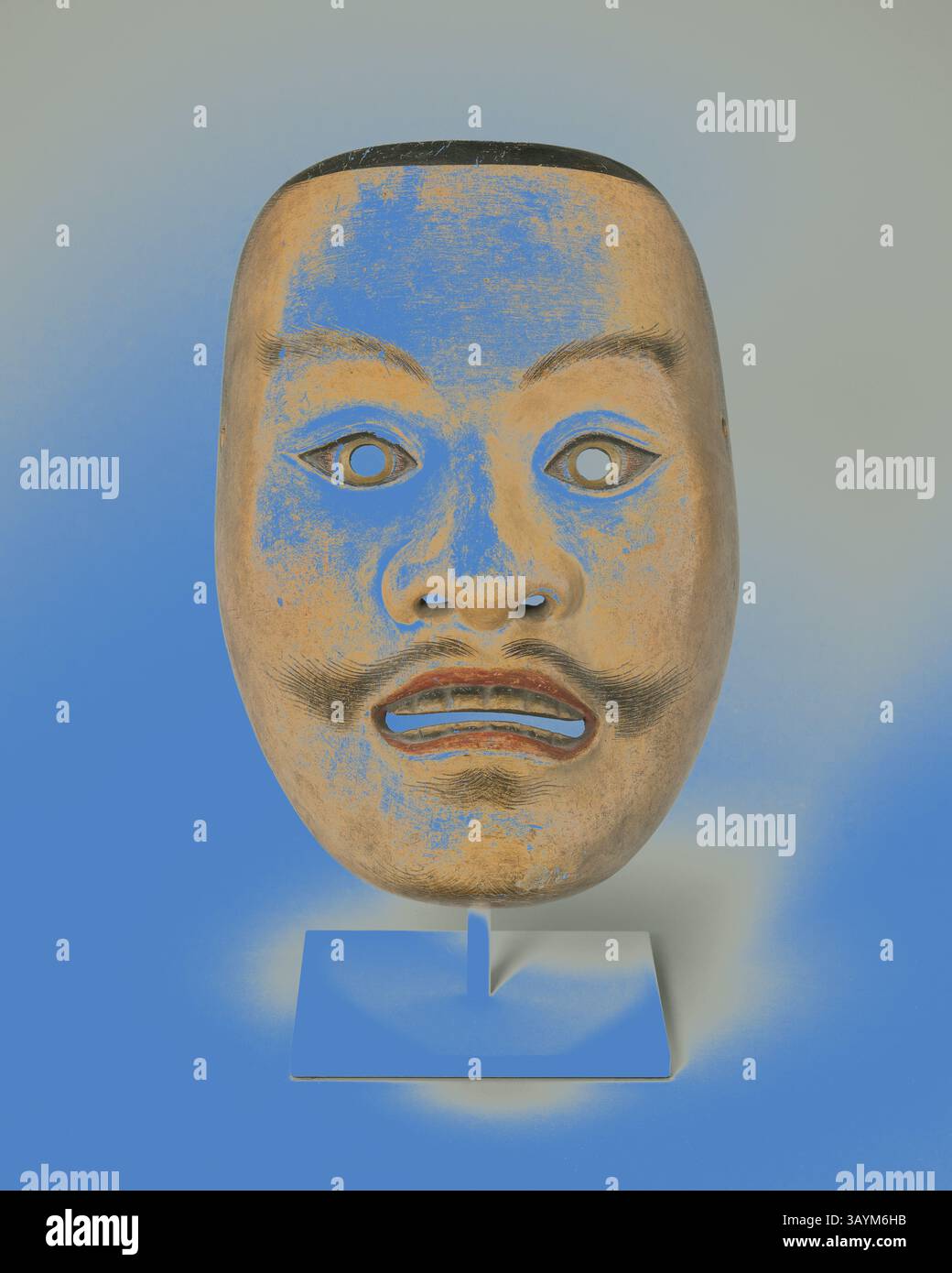 A stylized face mask featuring exaggerated facial features, including ...