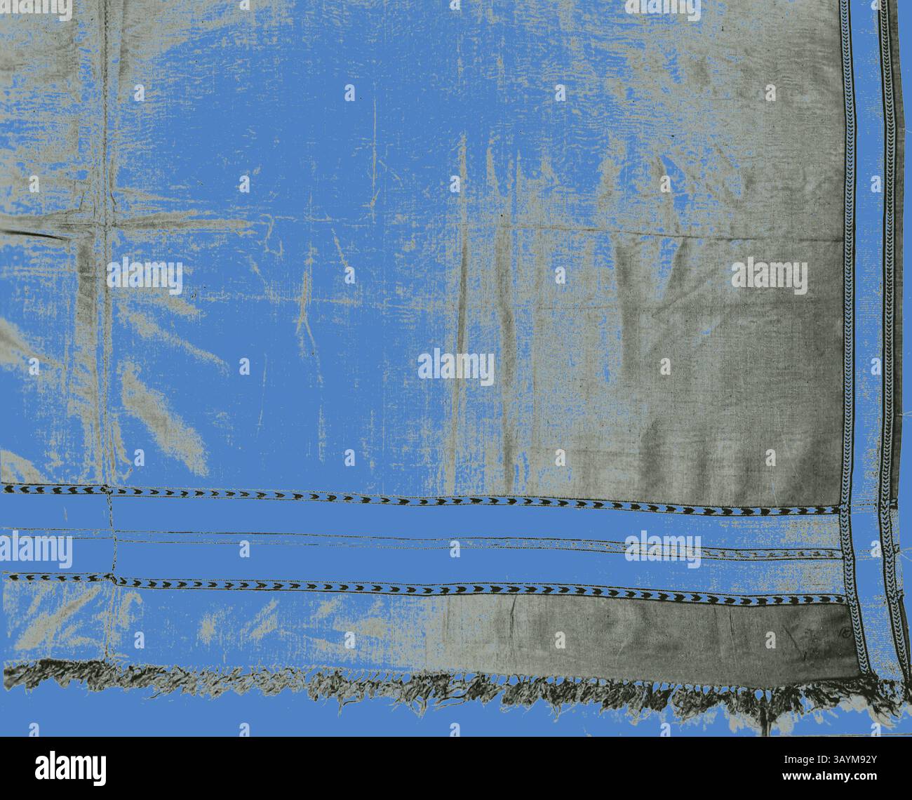 A textured fabric displays a blend of muted tones, with distinct ...