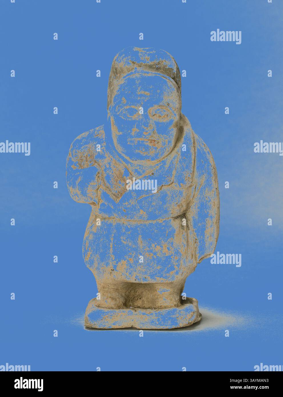 A small, ancient figure with a rounded body and intricate detailing ...