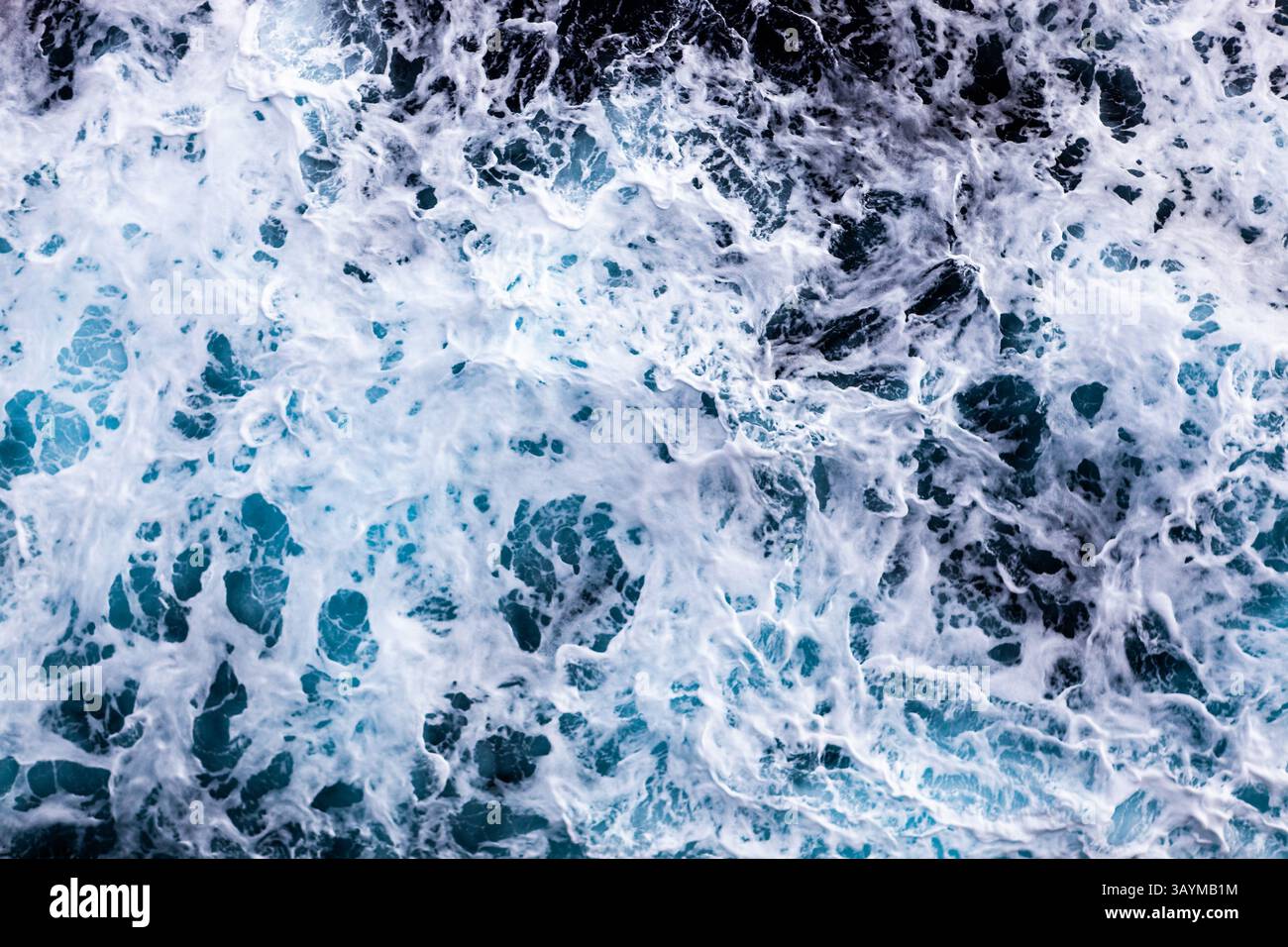 Sea surface texture. Aerial view of awesome water with foam. Can be ...