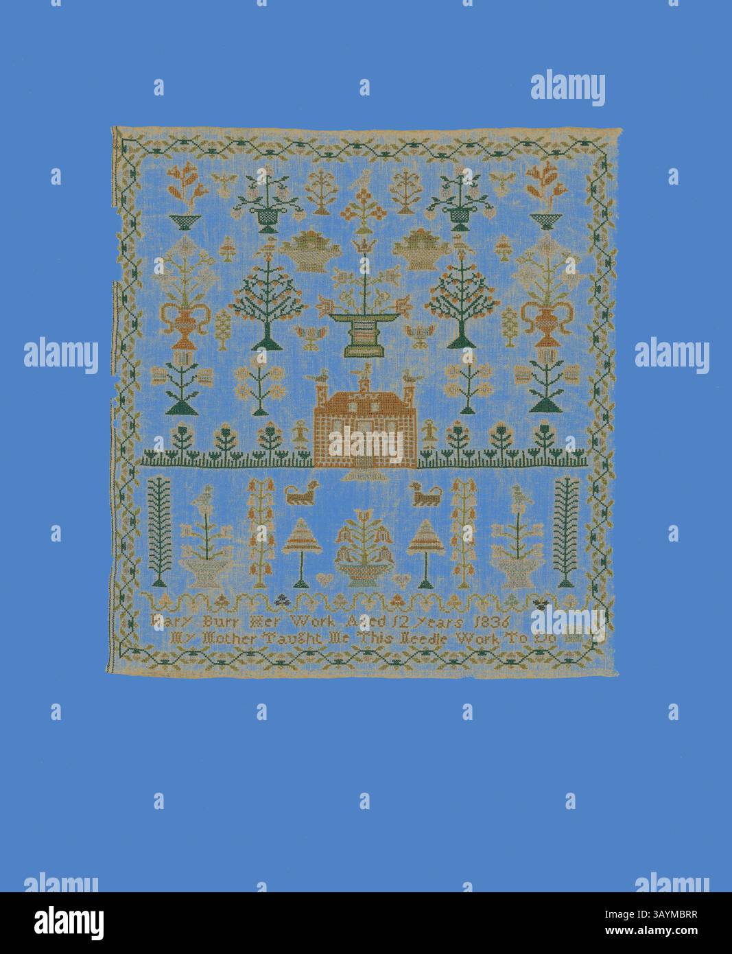 A detailed textile piece featuring intricate patterns of trees, flowers ...