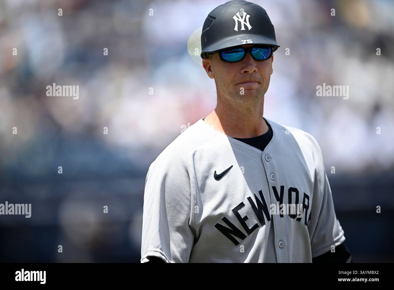 New York Yankees first base/infield coach Travis Chapman looks on ...