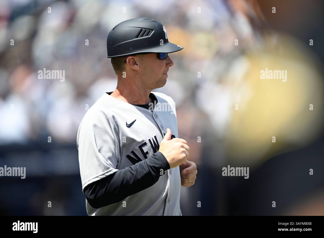 New York Yankees first base/infield coach Travis Chapman looks on ...