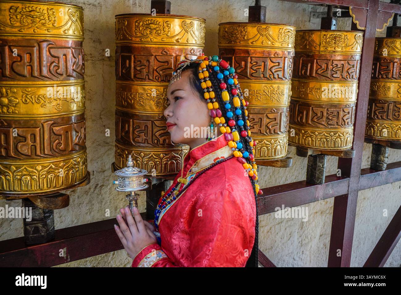 The act of spinning the wheel, known as mani khorlo, is a traditional ...