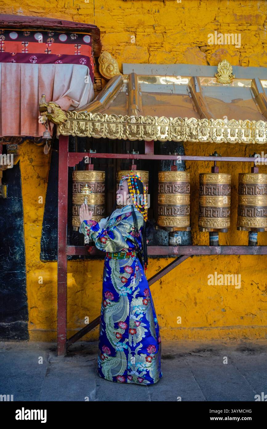 The act of spinning the wheel, known as mani khorlo, is a traditional ...