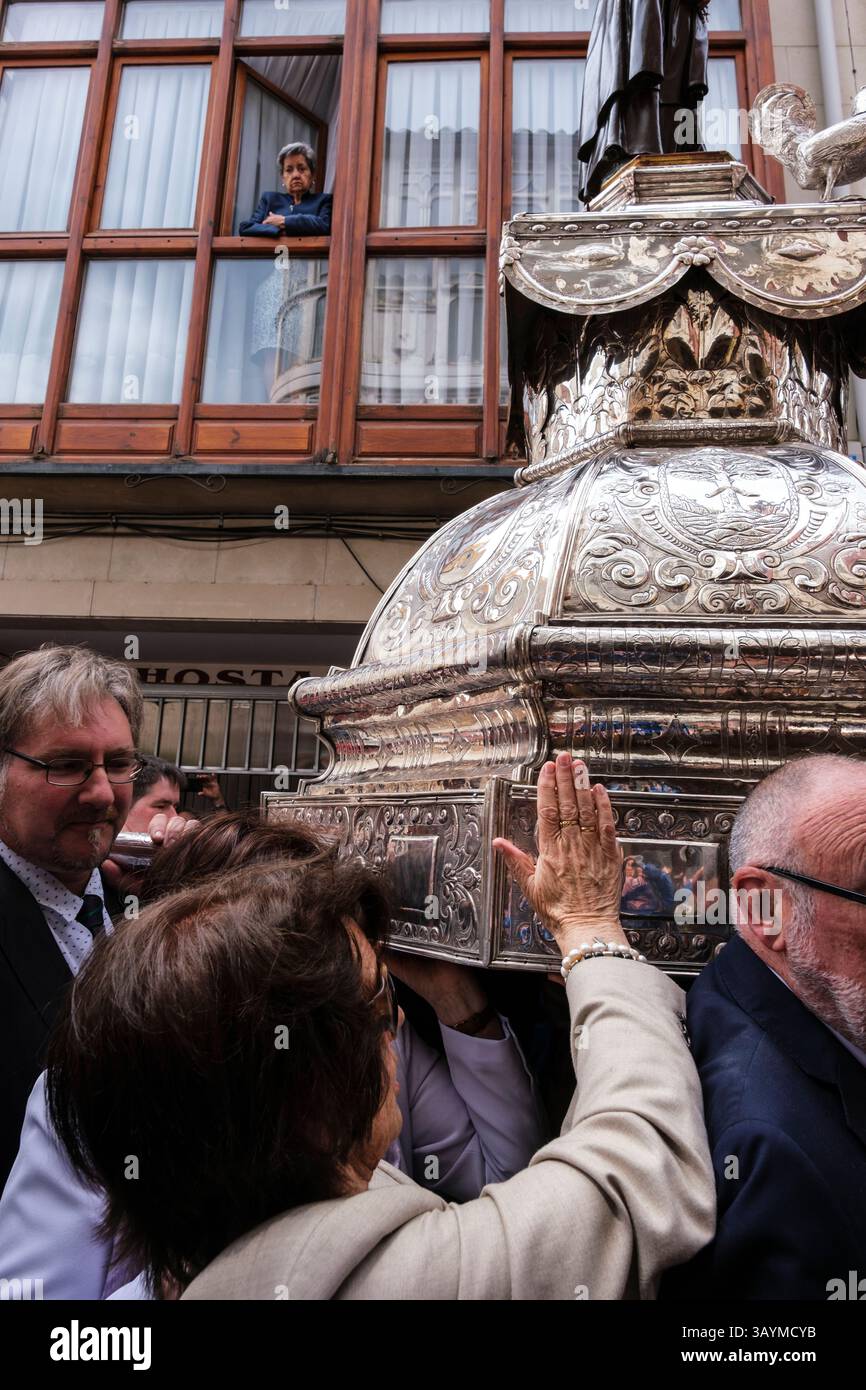 Spain, Santo Domingo de la Calzada. Woman Touching Base of Statue of ...
