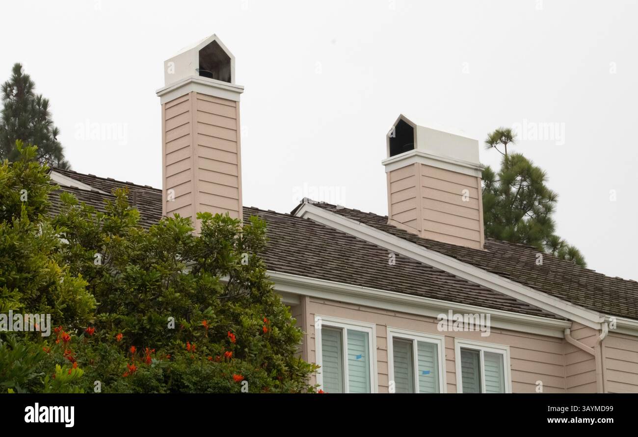 pink wood chimney roof tops Stock Photo - Alamy