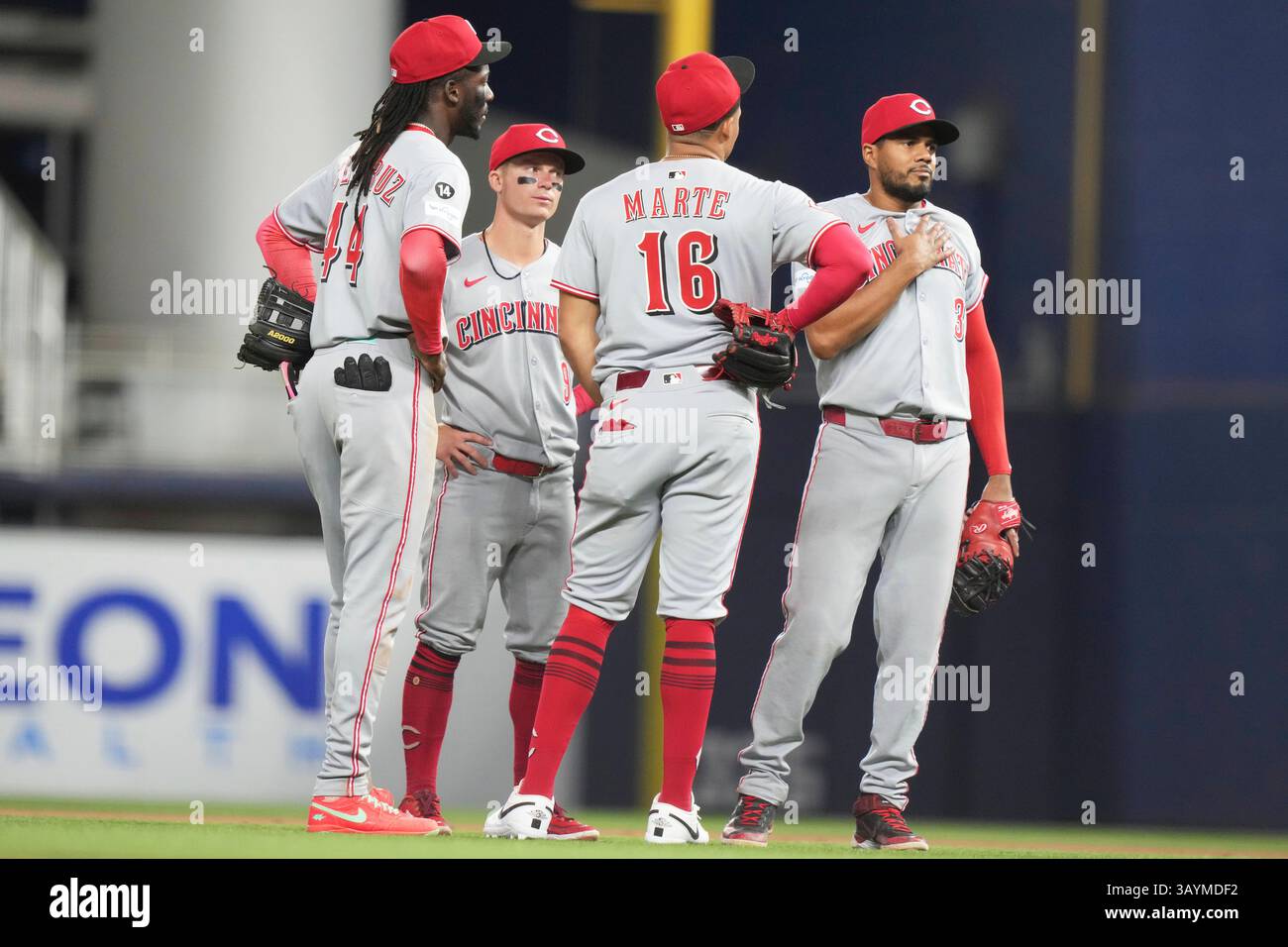 Cincinnati Reds shortstop Elly De La Cruz (44), second baseman Matt McLain, second from left ...