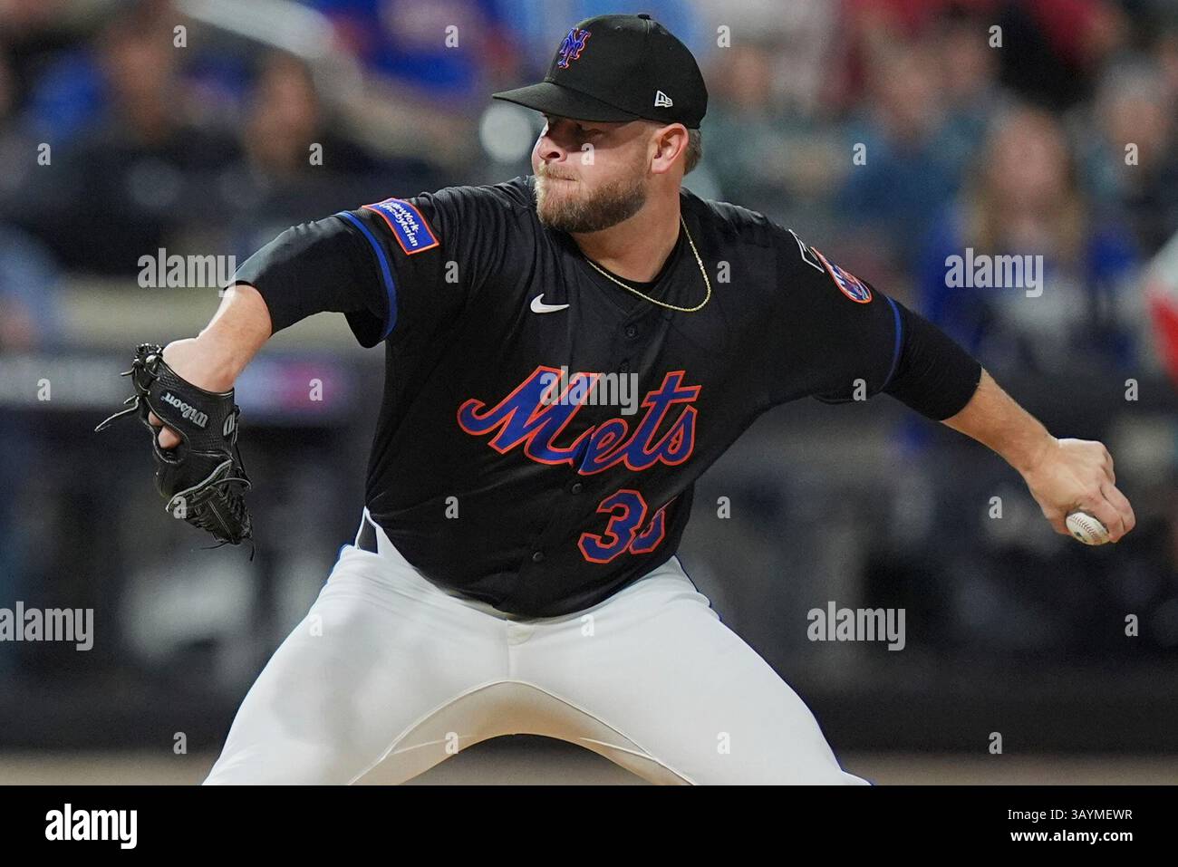 New York Mets' A.J. Minter pitches during the seventh inning of a ...