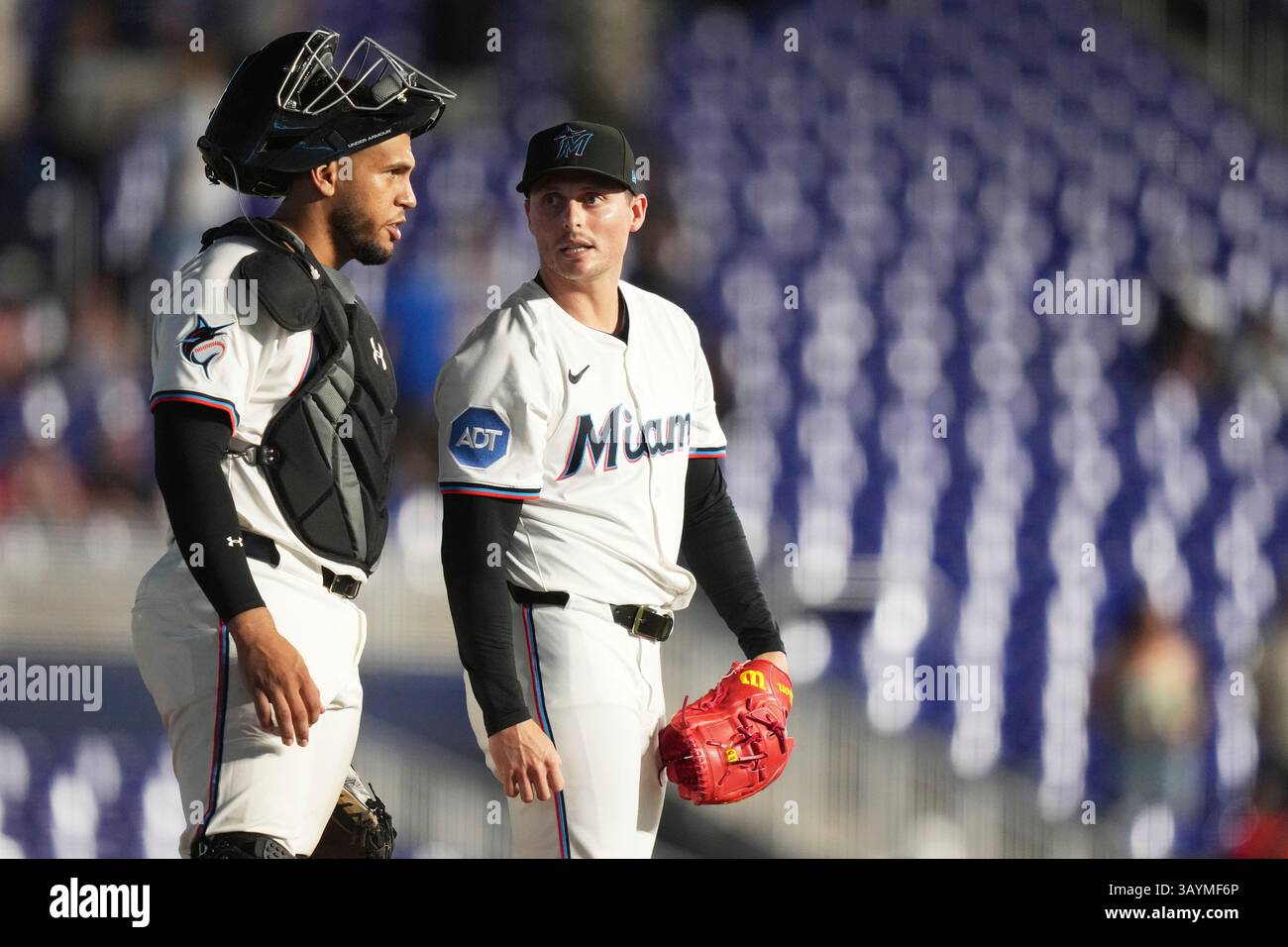 Miami Marlins catcher Agustin Ramirez, left, and relief pitcher Calvin ...