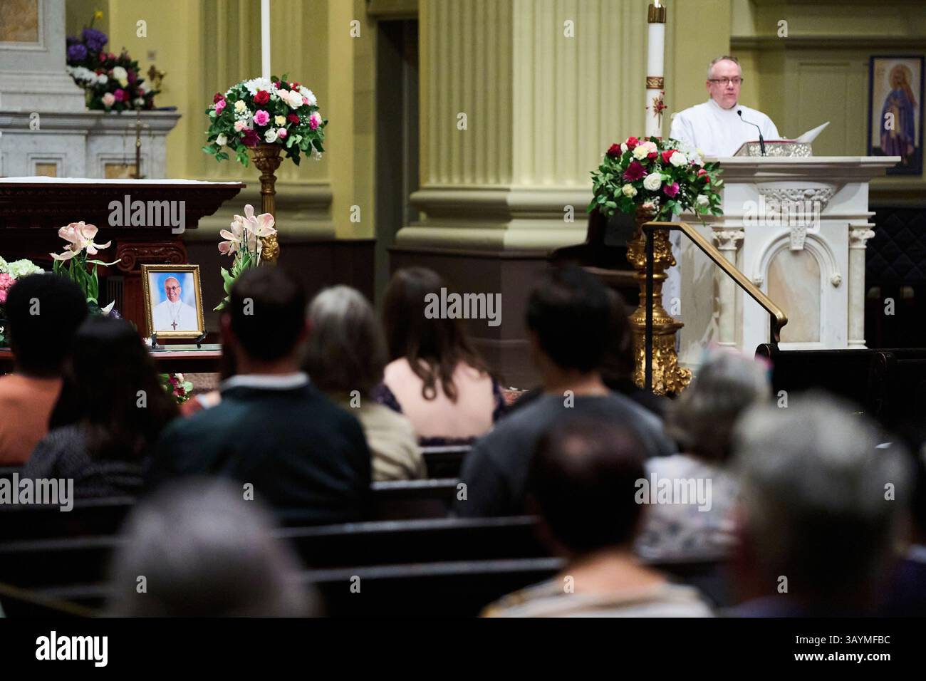Rev. Brian Frain, of the Society of Jesus, presides over a prayer ...