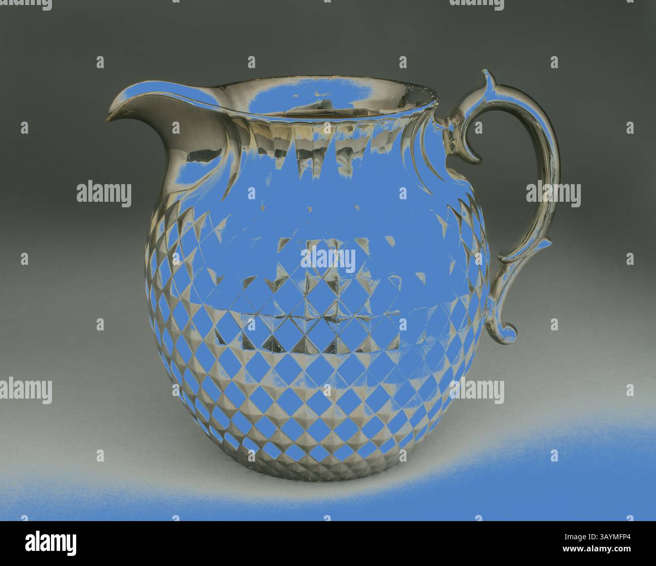 An elegant, intricately cut glass pitcher showcases a diamond-patterned ...