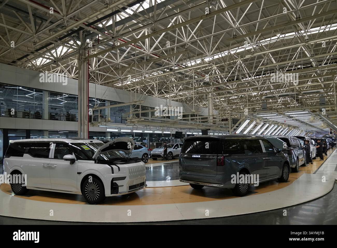 Workers perform final check on Zeekr EV models at the Chinese automaker ...