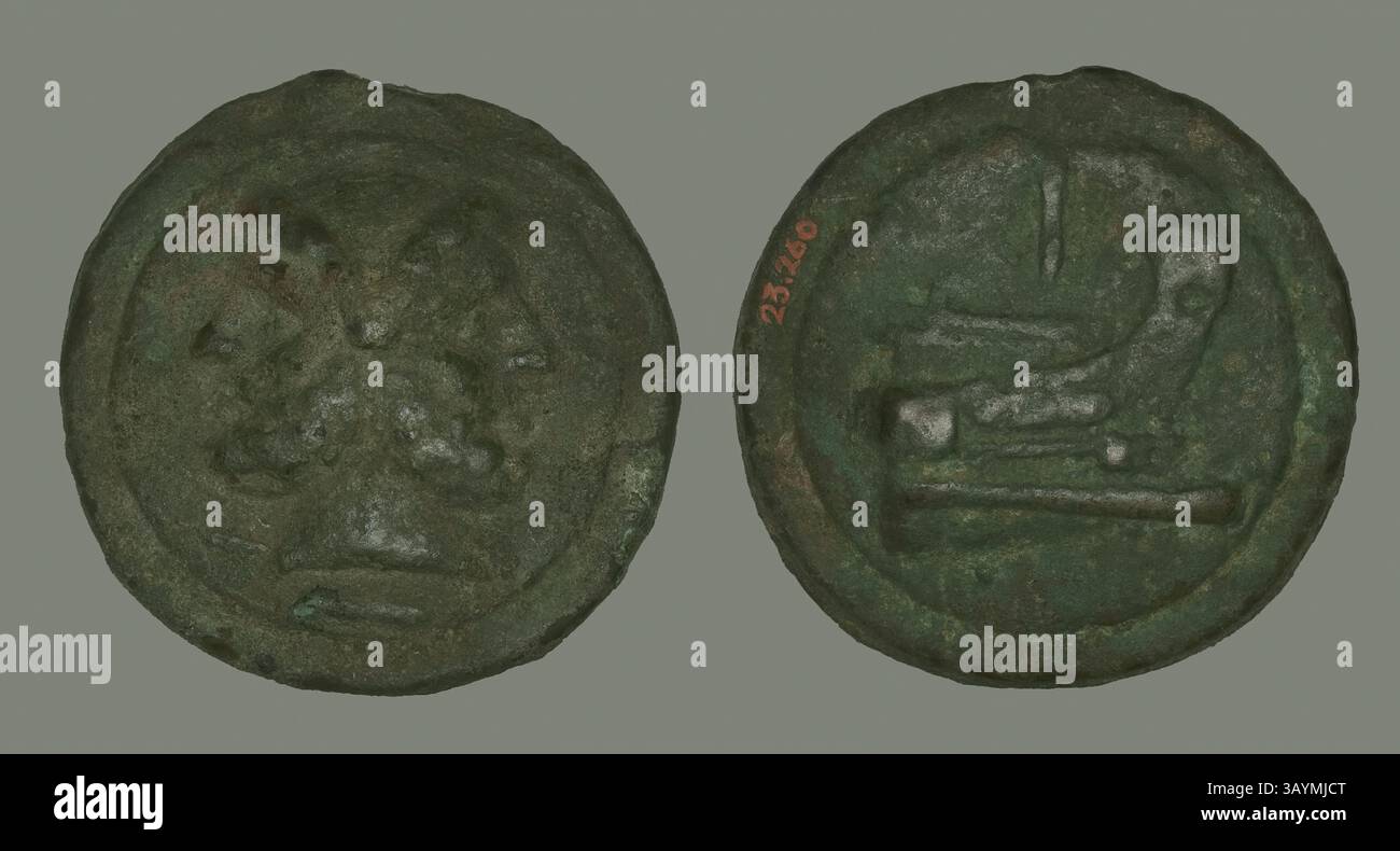 A circular ancient coin featuring distinct engravings on both sides ...