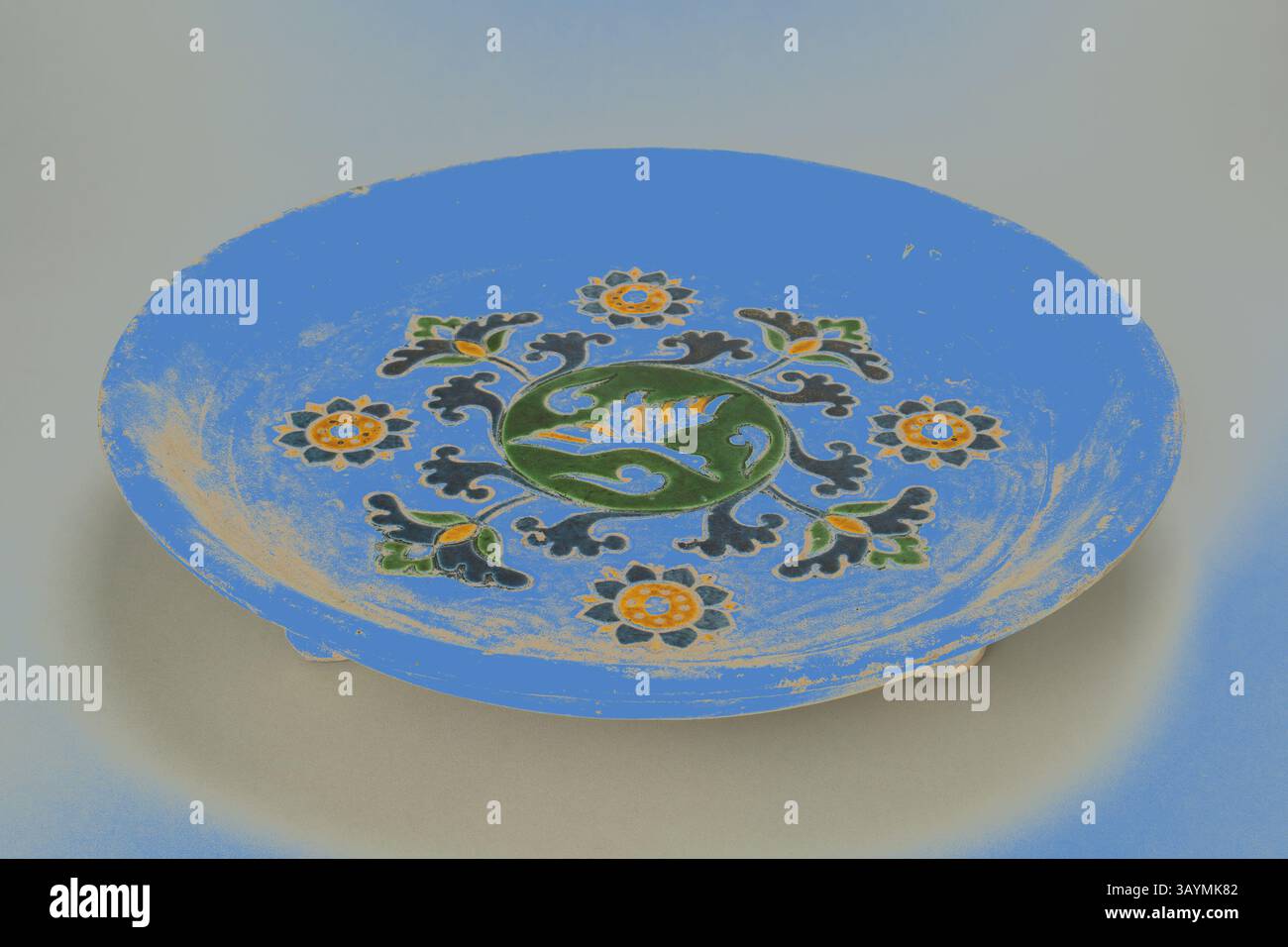 A beautifully crafted plate featuring intricate floral patterns and ...