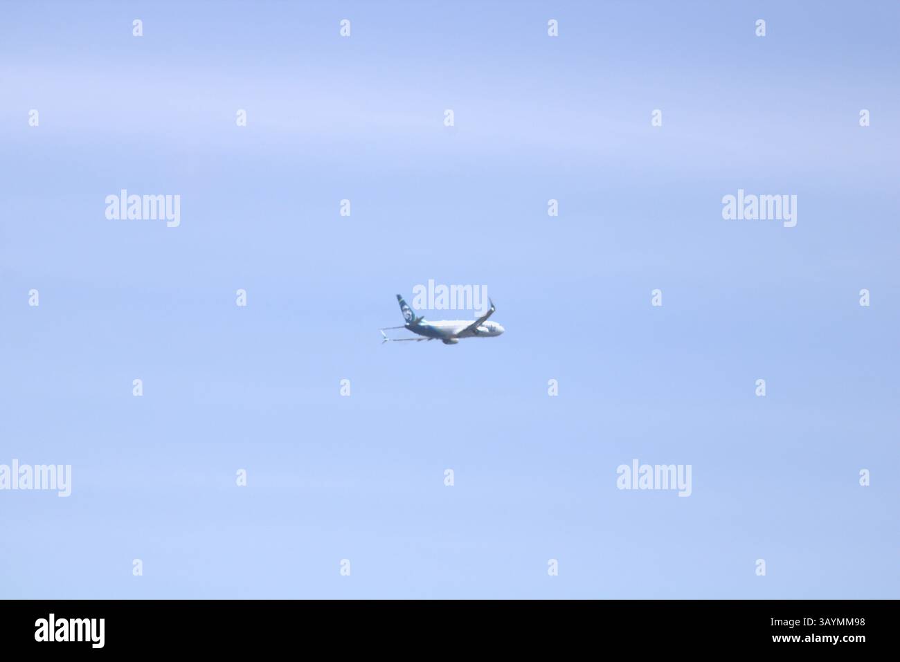 Commercial jet airplane flying across hi-res stock photography and ...