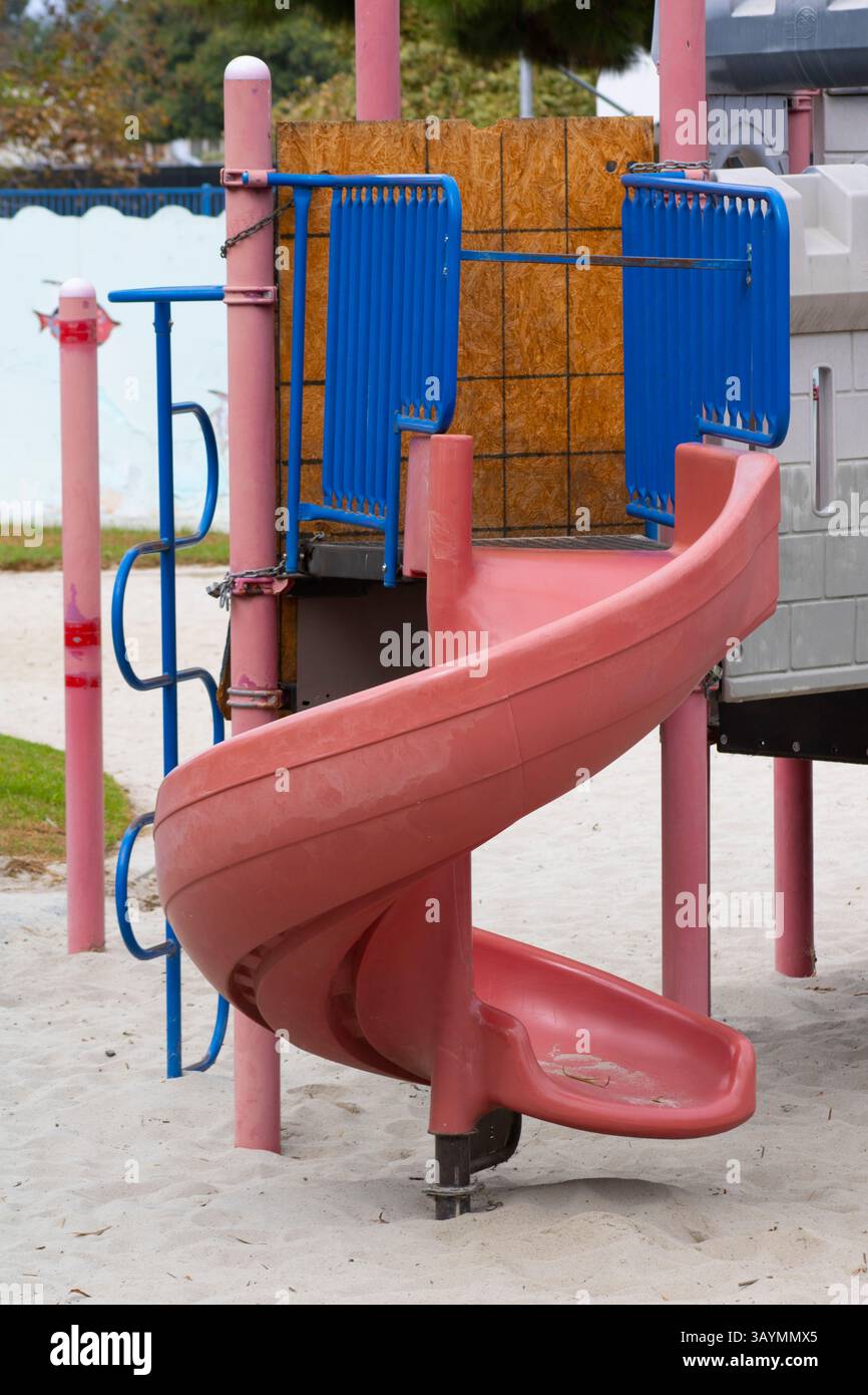 red slide at kids playground Stock Photo - Alamy