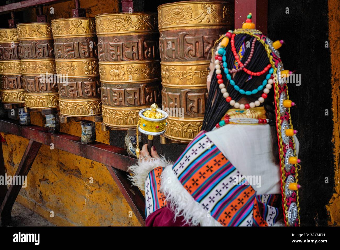 The act of spinning the wheel, known as mani khorlo, is a traditional ...