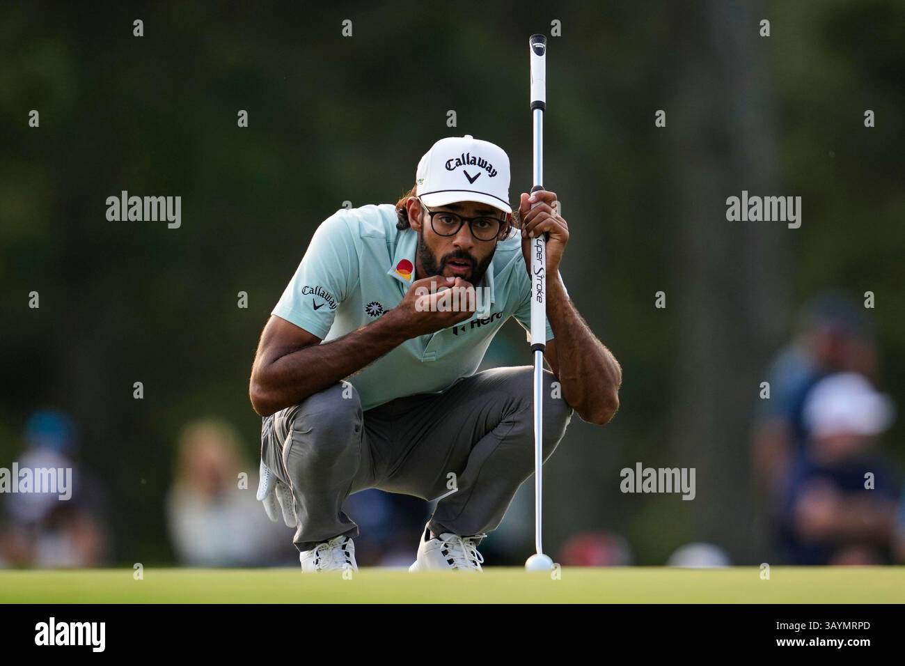 Akshay Bhatia lines up his shot on the 17th green during the first ...