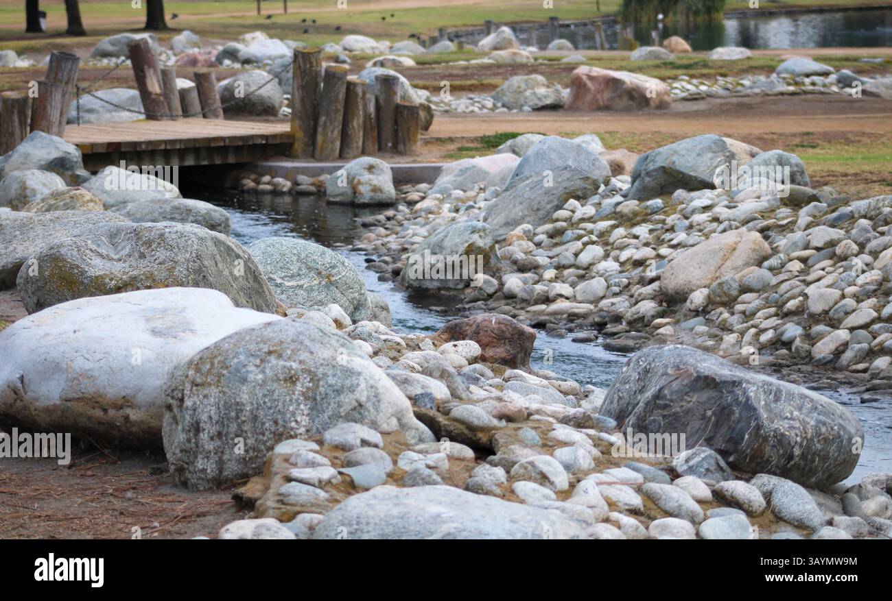 gray pile of rocks along waterside Stock Photo - Alamy