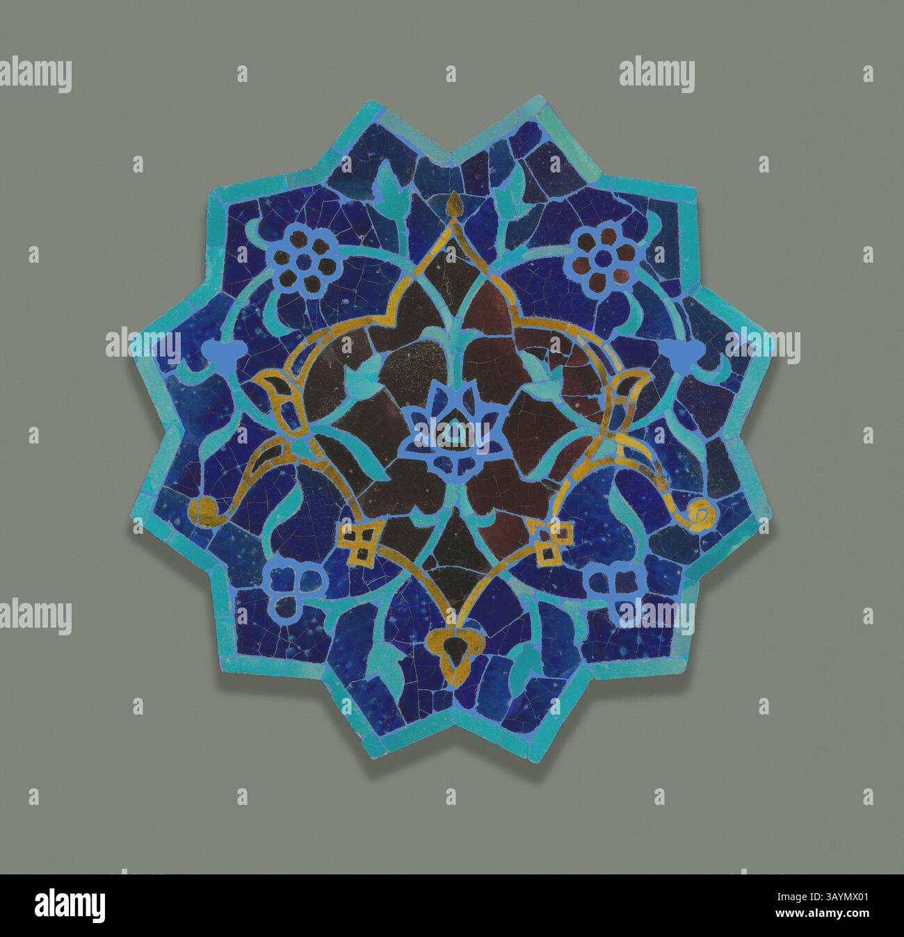 An intricate tile design featuring a symmetrical star shape adorned ...