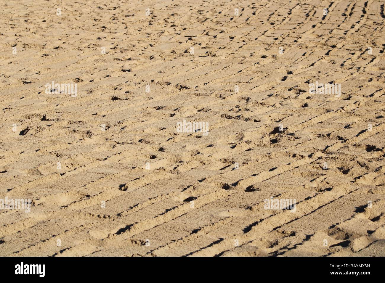 beach sand with texture footprints background Stock Photo - Alamy