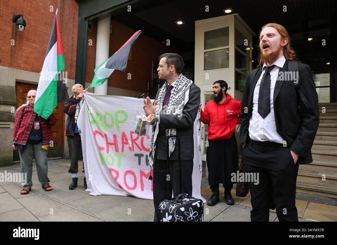 Drew (centre) and Adam address the crowd of supporters outside the ...