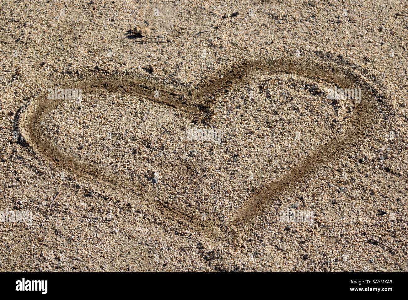 Heart outline in sand hi-res stock photography and images - Alamy
