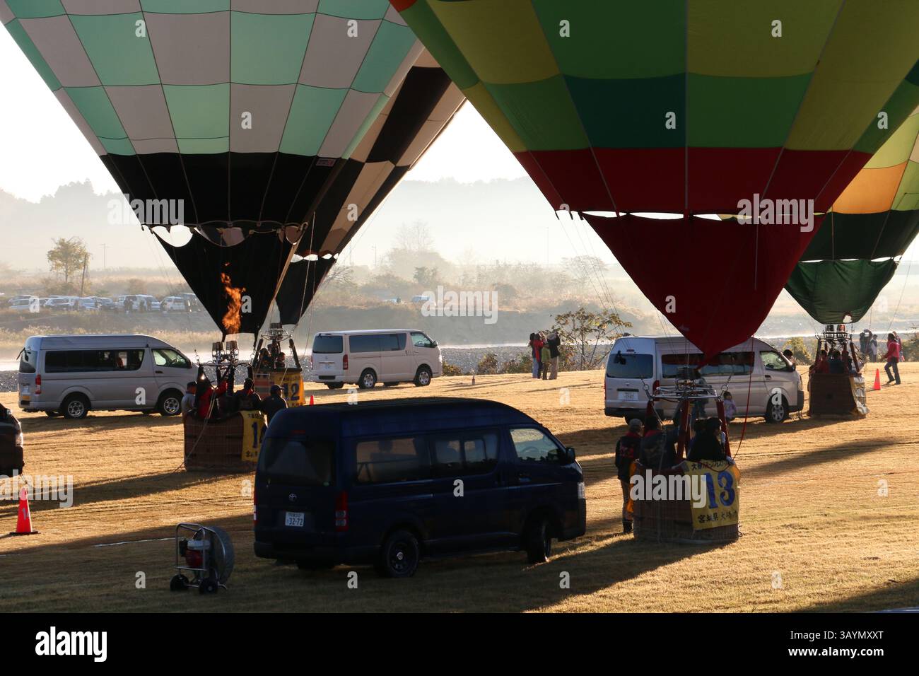 Hot air balloon teams wait for launch at the balloon festival in Osaki ...