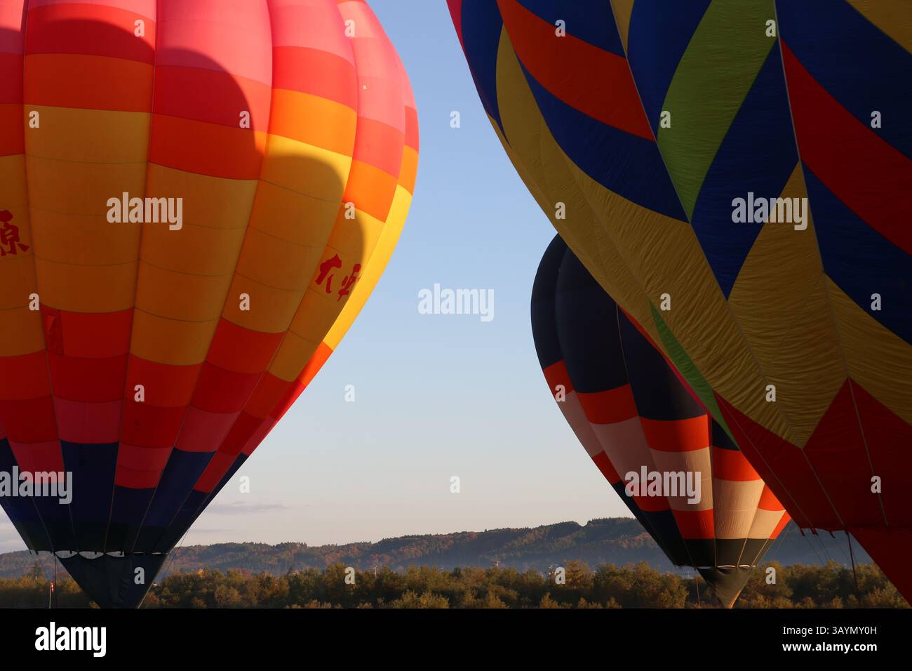 Hot air balloon teams wait for launch at the balloon festival in Osaki ...