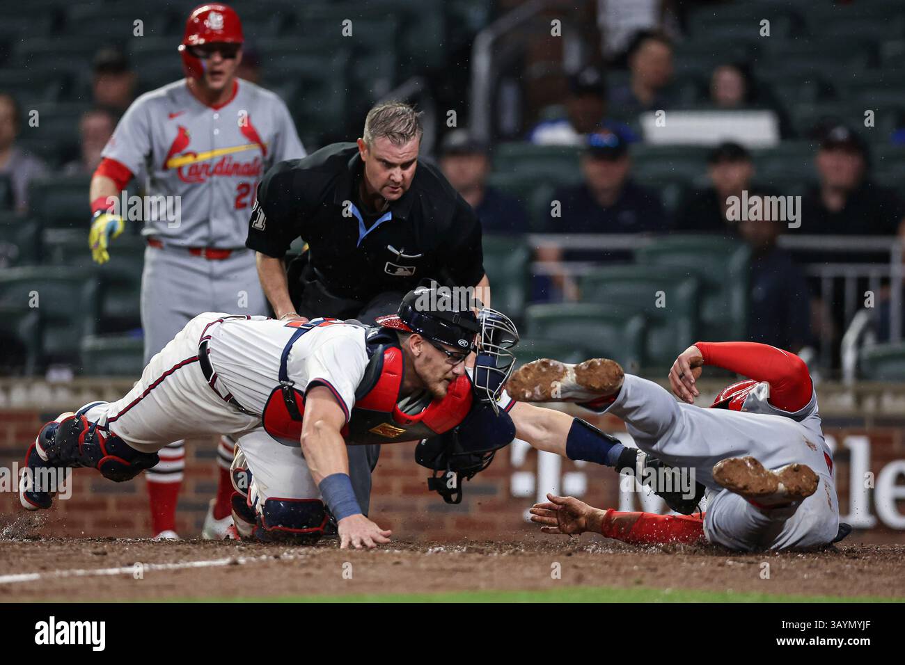 St. Louis Cardinals' Willson Contreras, right, slides into home plate ...