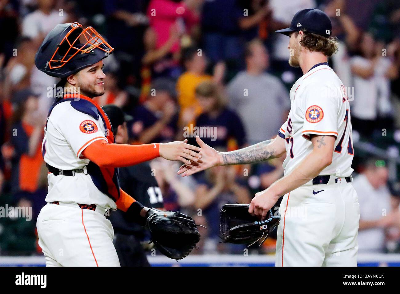 Houston Astros catcher Yainer Diaz, left, and closing pitcher Josh ...
