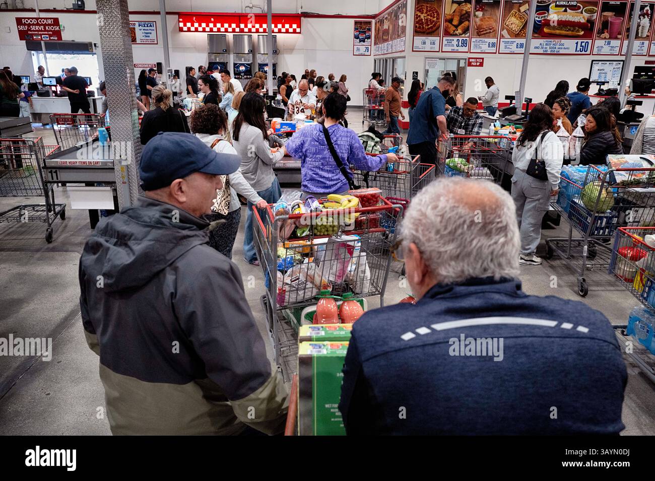 Shoppers line up to check out at a Costco Wholesale in the Van Nuys ...