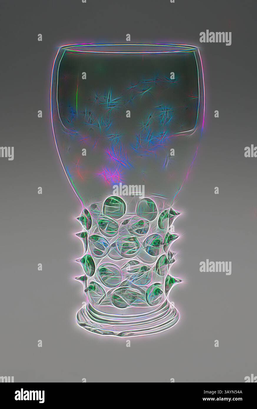 A uniquely shaped glass featuring a textured surface with circular ...