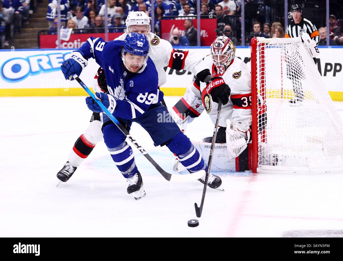 Toronto Maple Leafs' Nicholas Robertson (89) is chased by Ottawa ...