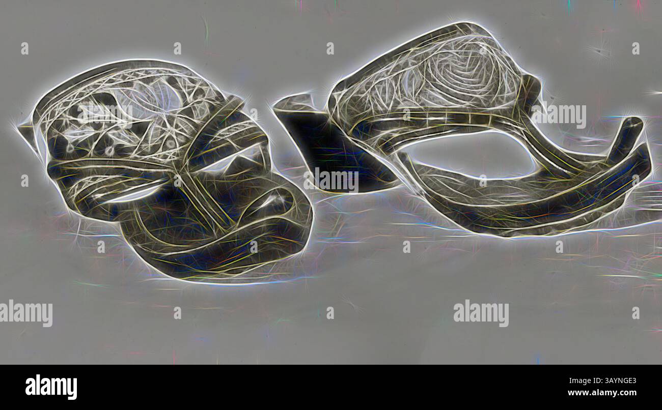 Two intricately carved masks, one featuring exaggerated facial ...