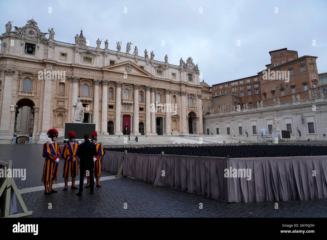Vatican Swiss Guards receive instructions by a security person in St ...