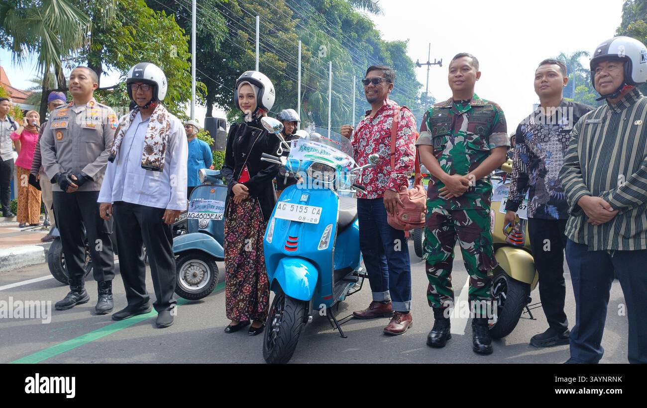 Vinanda Prameswati (Walikota Kediri) riding scooter together to celebrate Kartini day ...
