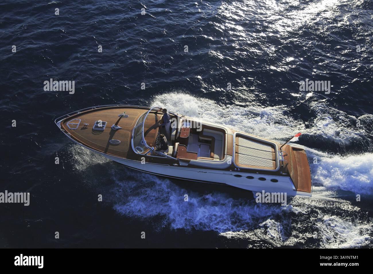 Aerial view sports boat J Craft 42 Torpedo R at full speed on the Cote ...