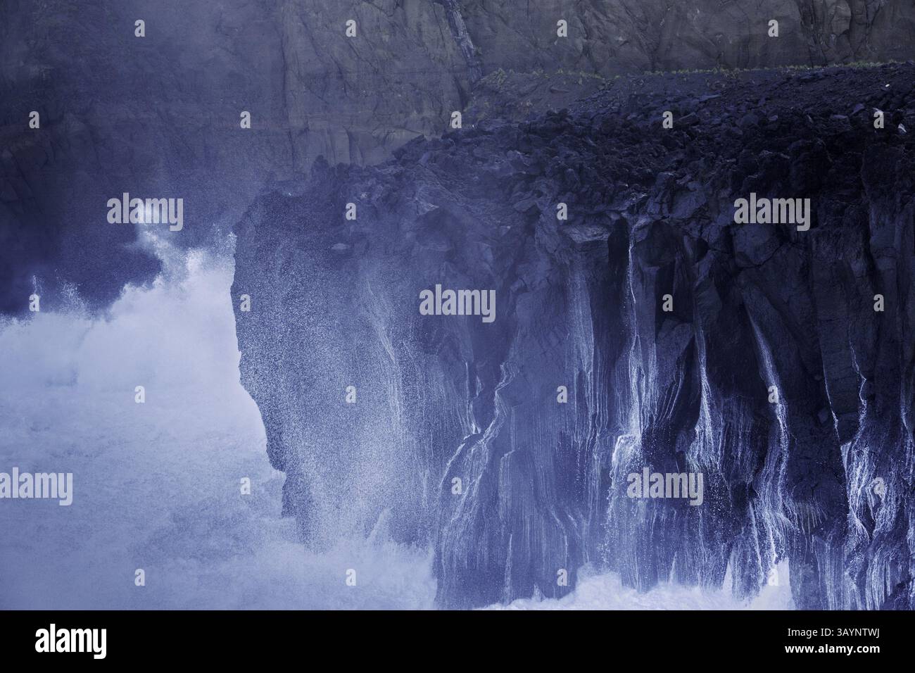 Ocean waves with splash break on volcanic cliffs, Azores Stock Photo ...