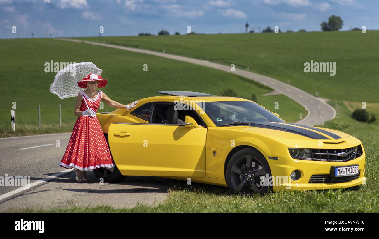 Woman in yellow dress leans hi-res stock photography and images - Alamy