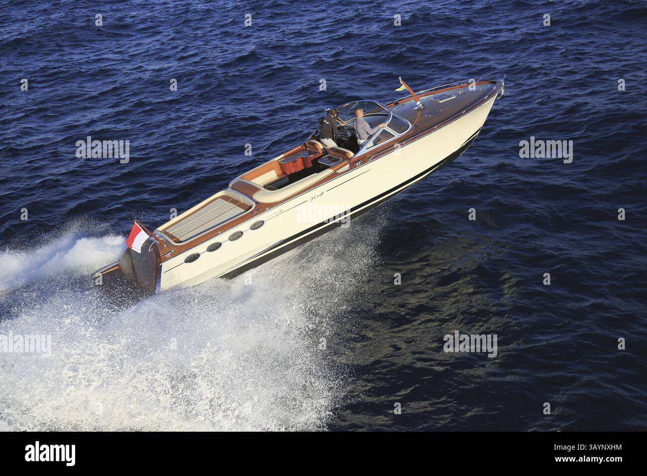 Aerial view sports boat J Craft 42 Torpedo R at full speed on the Cote ...