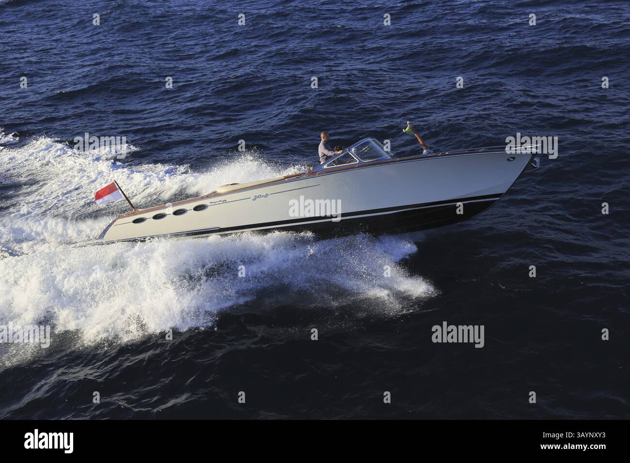 Aerial view sports boat J Craft 42 Torpedo R at full speed on the Cote ...