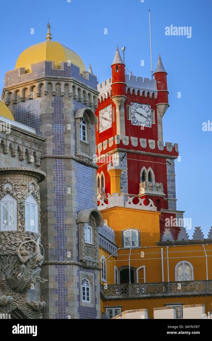 Pena castle red clock tower and blue mosaic towers in Sintra, Portugal ...