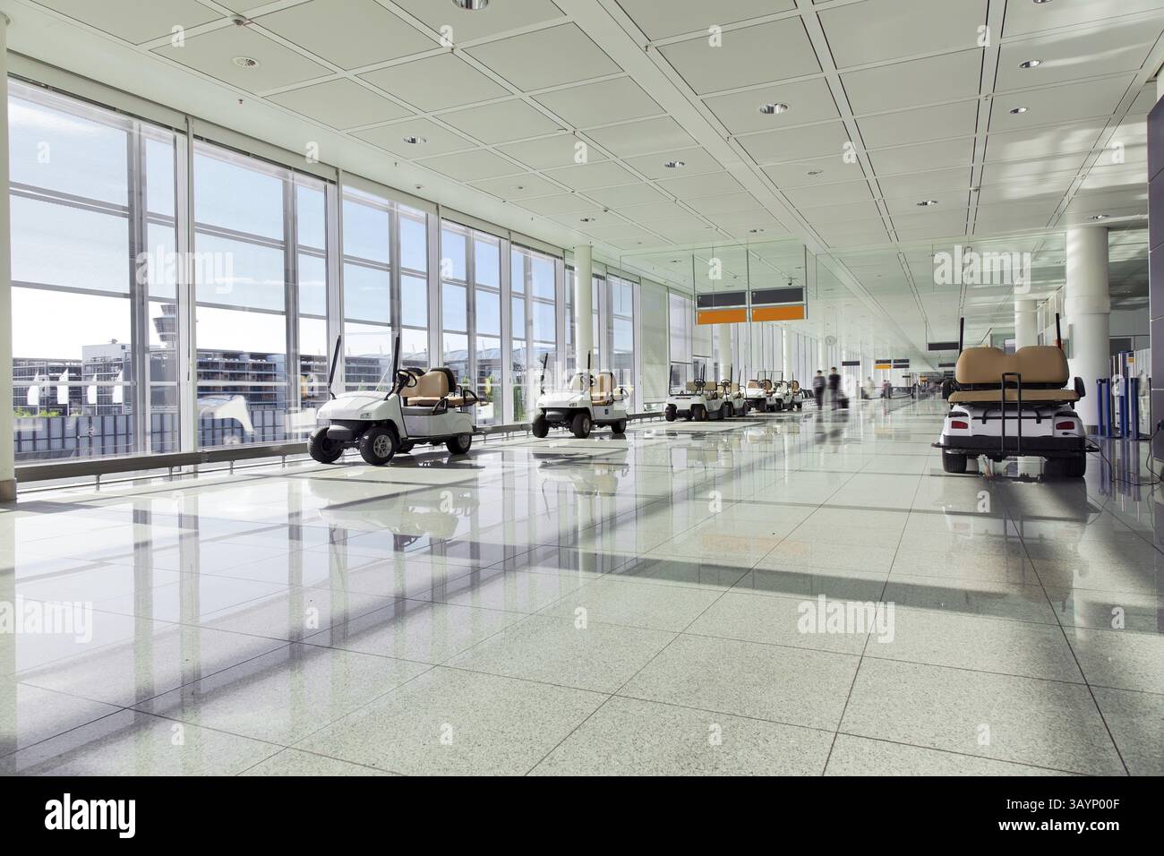 Airport terminal with vehicles for disabled passengers Stock Photo - Alamy