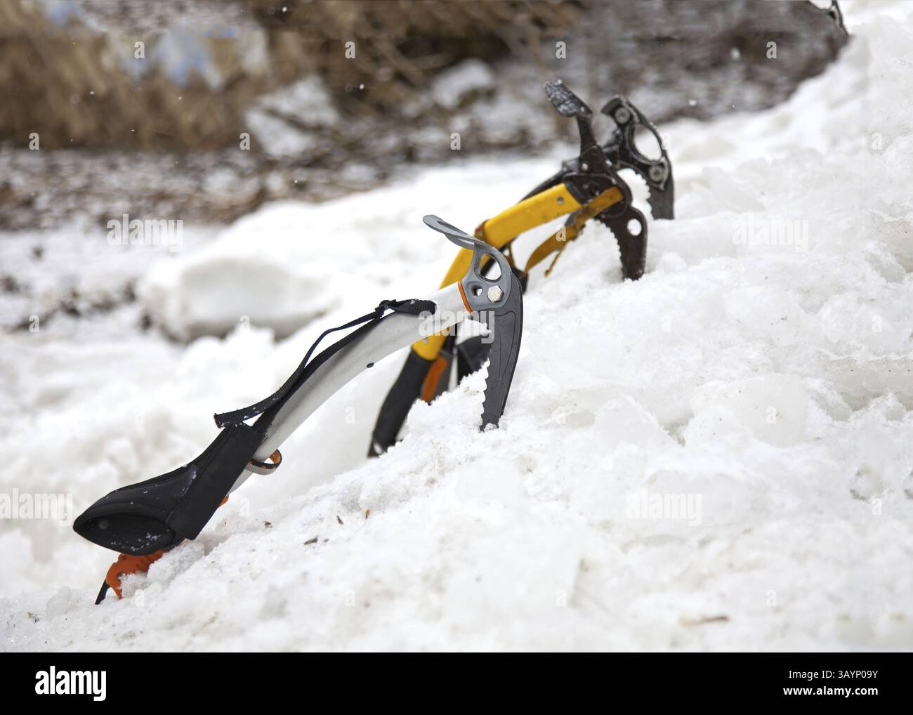 Three ice axes in the white snow Stock Photo - Alamy