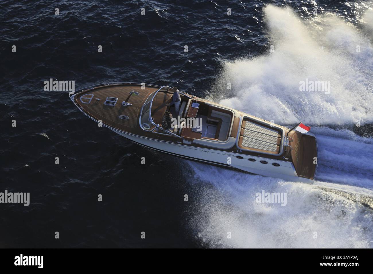 Aerial view sports boat J Craft 42 Torpedo R at full speed on the Cote ...
